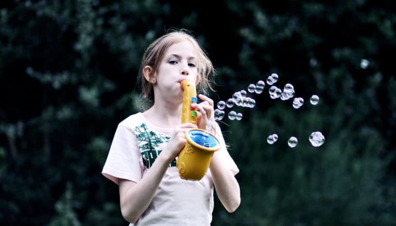 girl-blowing-bubbles-saxophone_1600 - Futurity